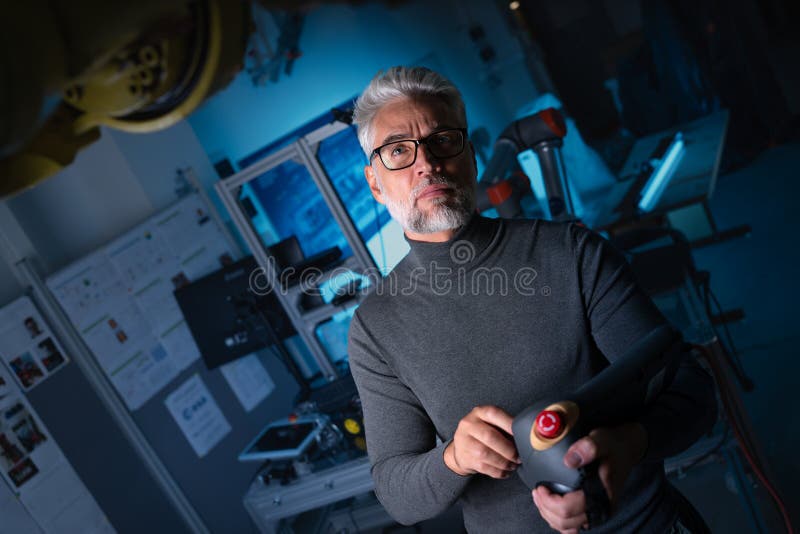 Automation Engineer, Technician Holding Remote Controller of Robotic ...