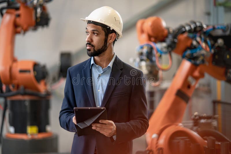 Automation Engineer Uses Tablet for Programming Robotic Arm in Factory ...