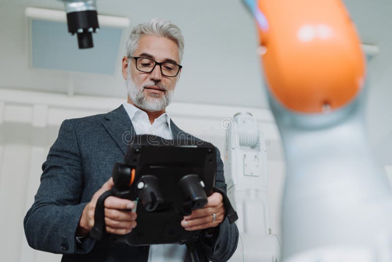 Automation, Robotics Engineer Working on Robotic Knee Replacement ...