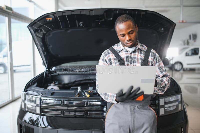 Automobile Computer Diagnosis. Car Mechanic Repairer Looks for Engine ...