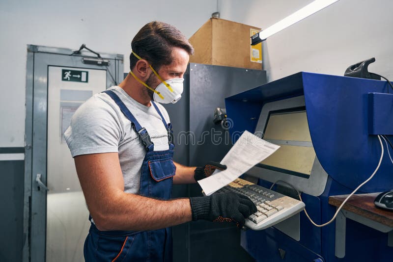 Automobile Mechanic is Entering Information into Computer Stock Image ...