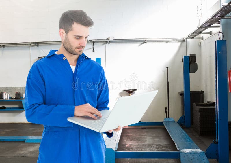 Automobile Mechanic Using Laptop in Workshop Stock Photo - Image of ...