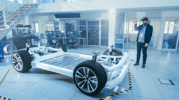 Automotive Engineer Working on Electric Car Chassis Platform, Using ...