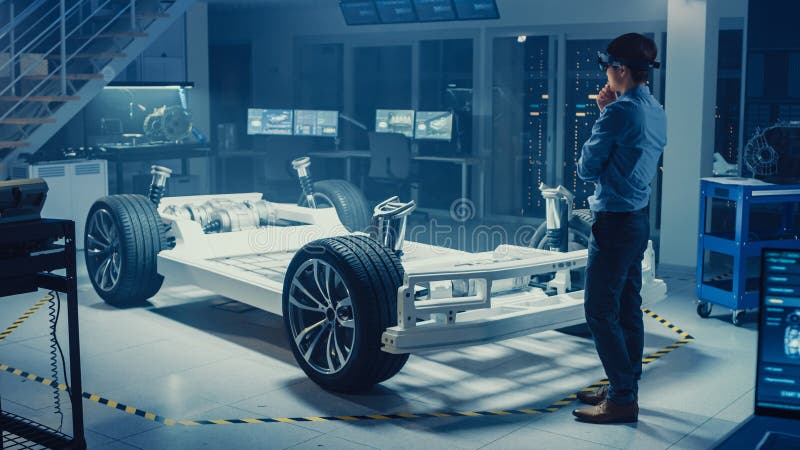 Automotive Engineer Working on Electric Car Chassis Platform, Using ...