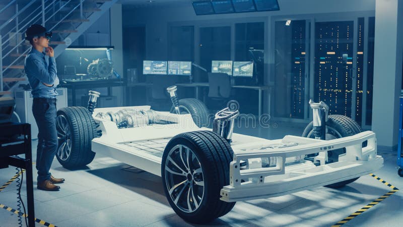 Automotive Engineer Working on Electric Car Chassis Platform, Using ...