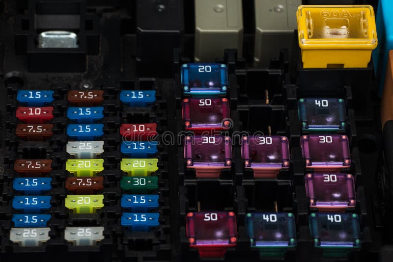 Automotive Fuses On A Black Panel With Holders And Multi-colored ...