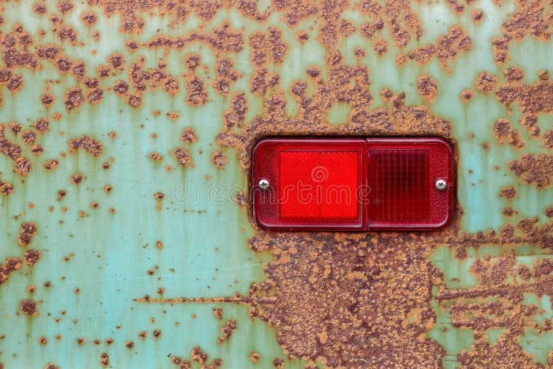 Automotive Indicator Lamp on a Rusty Sheet Metal Stock Image - Image of ...