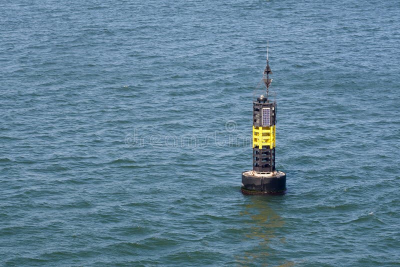 Red buoy with solar panel stock photo. Image of waves - 8068204