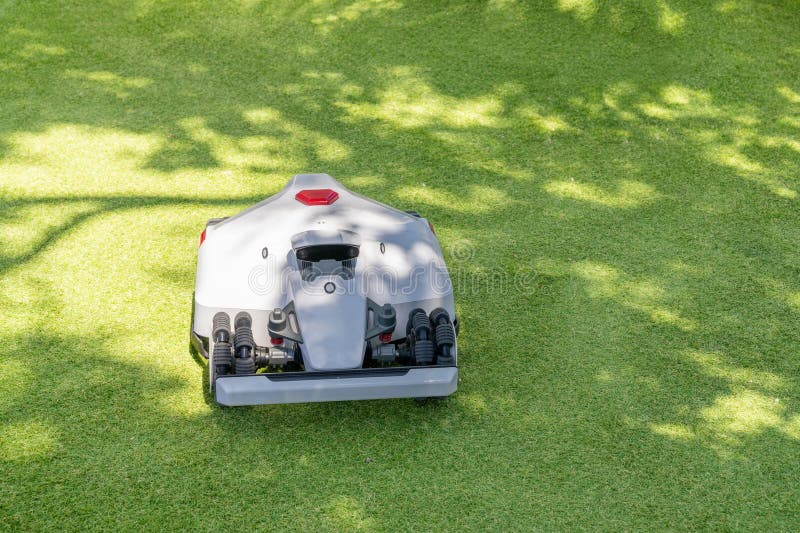 Autonomous Robot Lawnmower on a Green Field. Stock Image - Image of ...