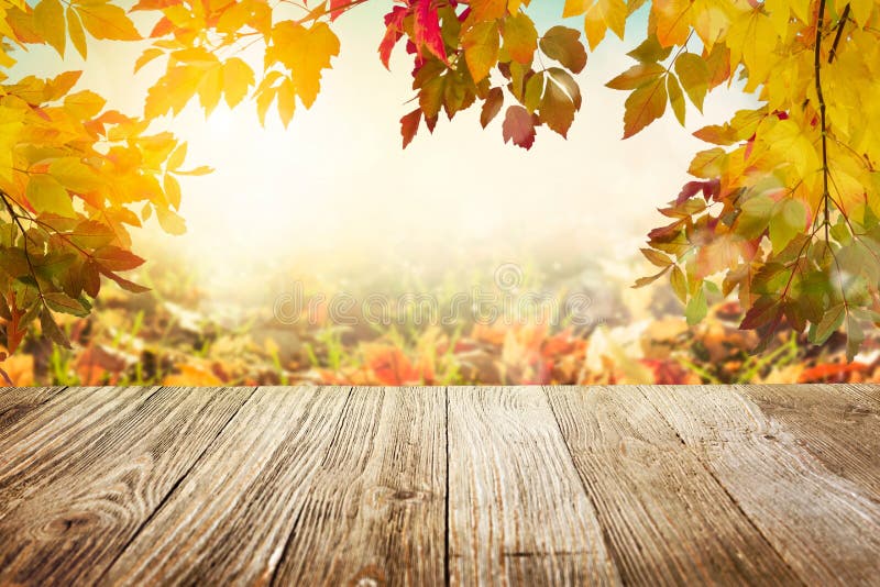 Empty Wooden Table Top with Blurred Autumn Abstract Background. Stock ...