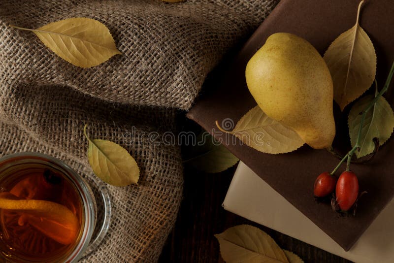 Autumn Composition with Hot Tea Pears, Books and Rosehip. Stock Photo ...
