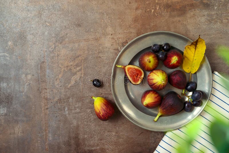 Autumn Concept with Fresh Figs on Plate Over Dark Background. Top View ...
