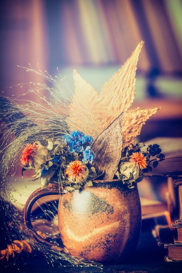 Autumn Deco Bunch with Fall Leaves and Flowers in Vintage Cup Stock ...