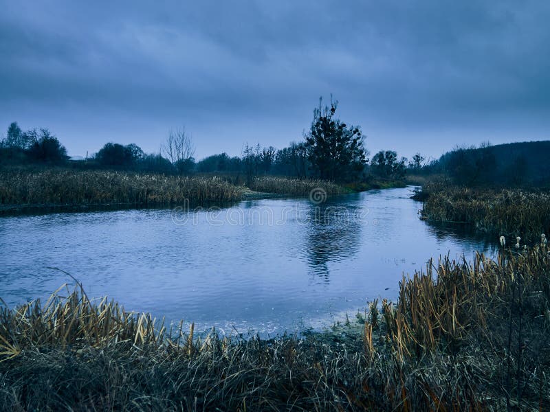 Autumn Evening on a Small Forest River, the Sun Has almost Set, Cloudy ...