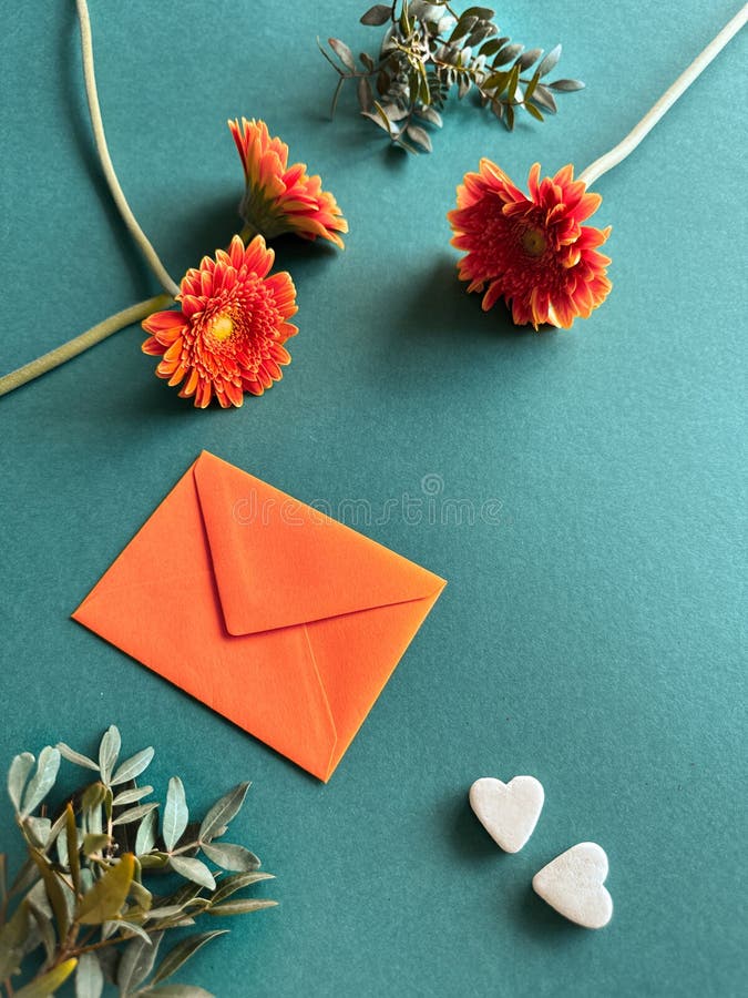 Autumn Floral Flat Lay with Orange Envelope on Teal Background Stock ...