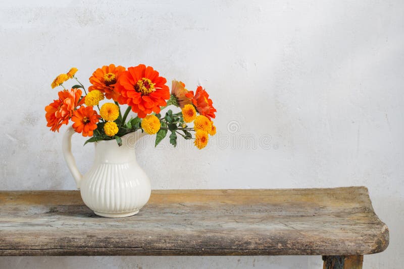 Autumn Flowers in Pitcher on Wooden Bench Stock Image - Image of beauty ...