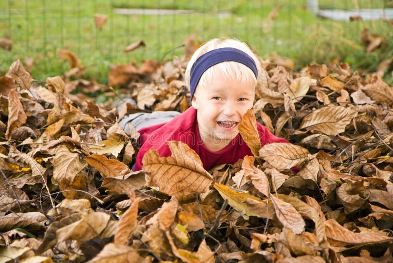 Autumn fun with leaves. stock image. Image of smile - 160587809