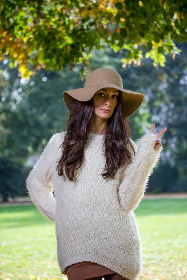 Autumn Girl Making the Peace Sign Stock Image - Image of park, looking ...