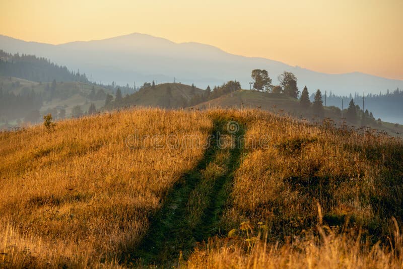 Autumn in the Hilly Mountains. Path among the Hills with Yellow Grass ...