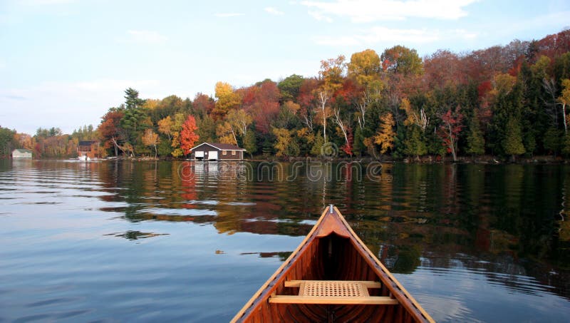 Autumn Lake Reflection with a Canoe Stock Image - Image of green, fall ...