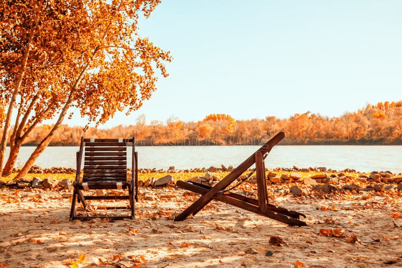 Autumn Landscape with Two Chairs on the Sandy River Bank Stock Image ...