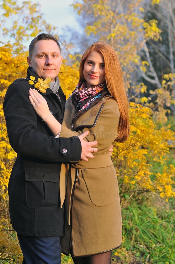Autumn Leaves in Hands Couple Hug Stock Photo - Image of walk, hugging ...