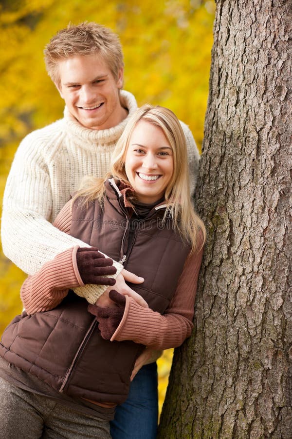 Young Couple Running Along Woodland Path Stock Image - Image of autumn ...