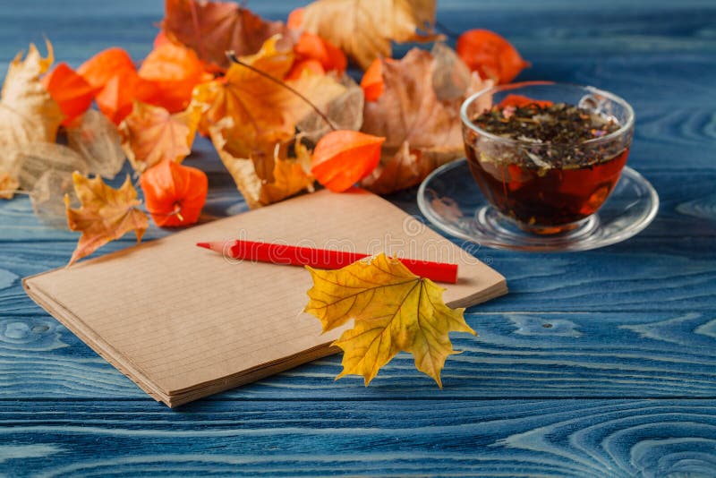 Autumn notes on blue table stock image. Image of beautiful - 78572625