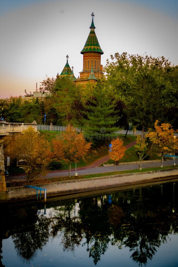 Autumn Photo of Timisoara Cathedral Reflecting in Bega River Stock ...