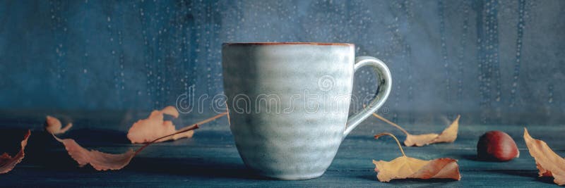 Autumn Rain Panorama with a Cup of Tea and Autumn Leaves Stock Photo ...