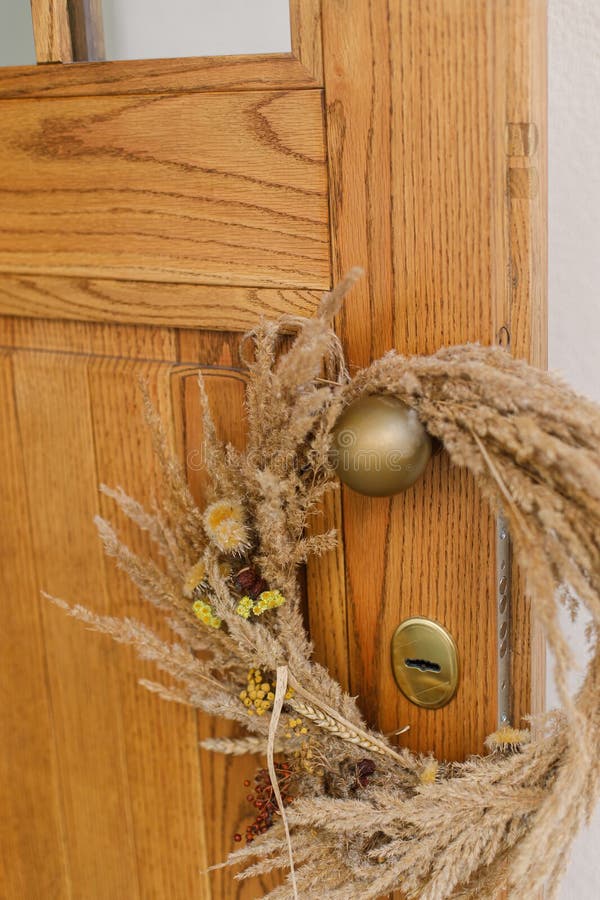 Autumn Rustic Wreath on Brass Retro Handle Wooden Front Door. Stylish ... Autumn Rustic Wreath on Brass Retro Handle Wooden Front Door. Stylish ...