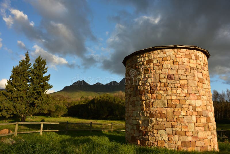The Autumn Sun Setting on an Old Stone Silo Stock Image - Image of ...