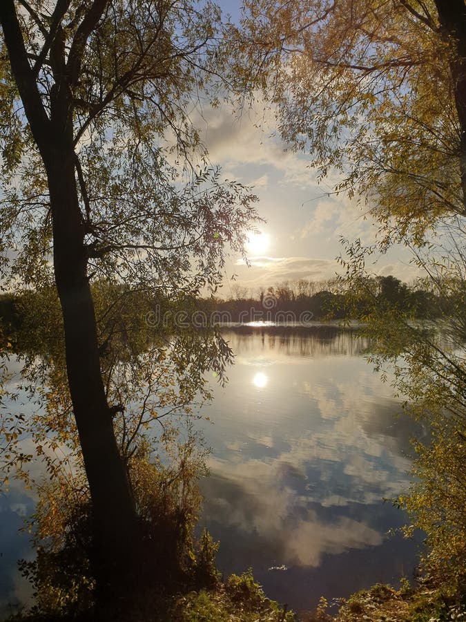 Autumn Sun Setting Over Lake Stock Image - Image of setting, autumn ... Autumn Sun Setting Over Lake Stock Image - Image of setting, autumn ...