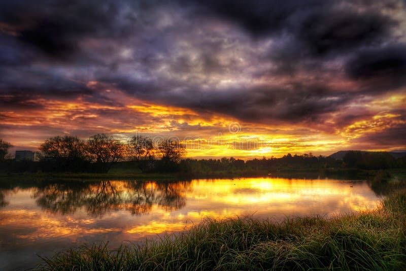 Autumn sunrise over a lake stock photo. Image of dusk - 61024590