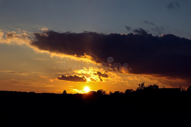 Autumn Sunset: Golden Rays of the Sun Sparkle on Dark Clouds ...