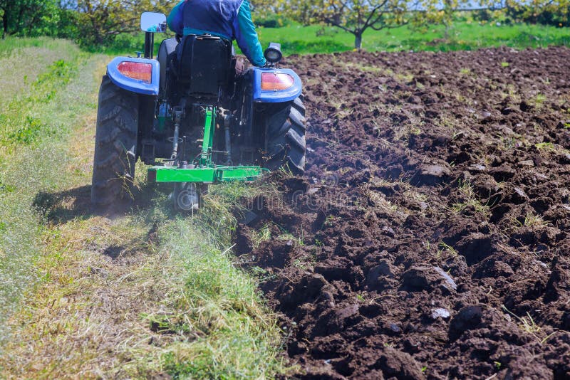 Farm Tractor Preparing the Soil with for Sowing is Process of Planting ...