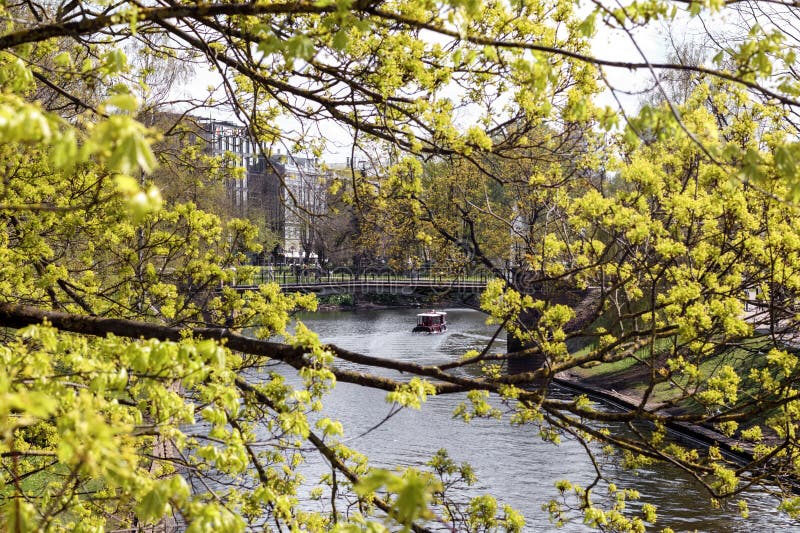 . Autumn View in the Park with a Small Ship in the Canal between Tree ...