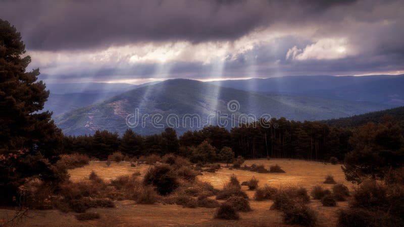 Autumnal Scene with Sun Rays, Clouds and Mountains Stock Photo - Image ...