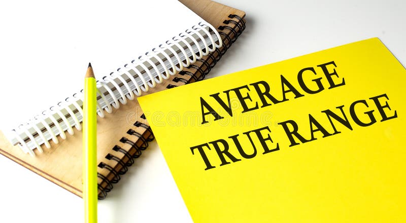AVERAGE TRUE RANGE Text Written on a Yellow Paper with Notebook Stock ...