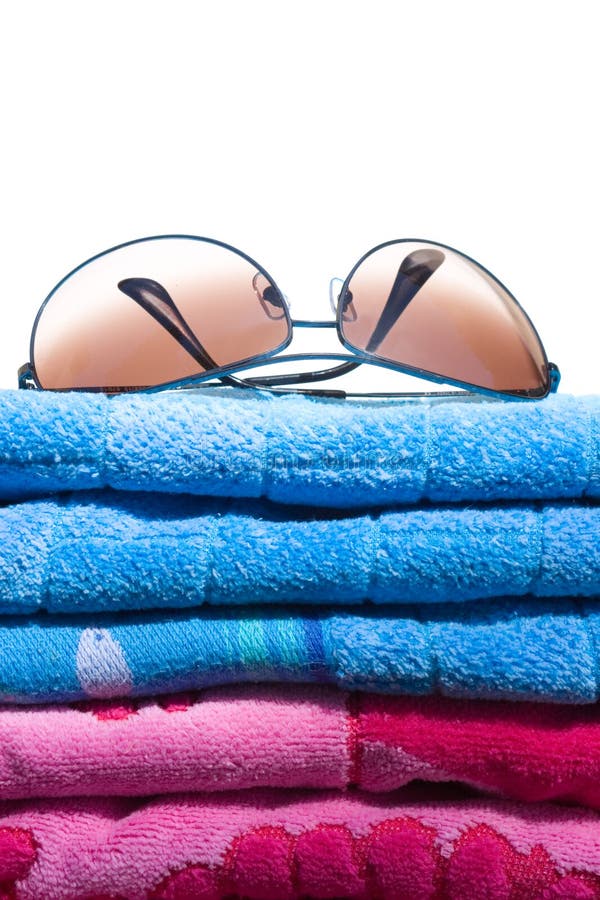 Aviator Sunglasses on a Stack of Beach Towels Stock Image - Image of ...