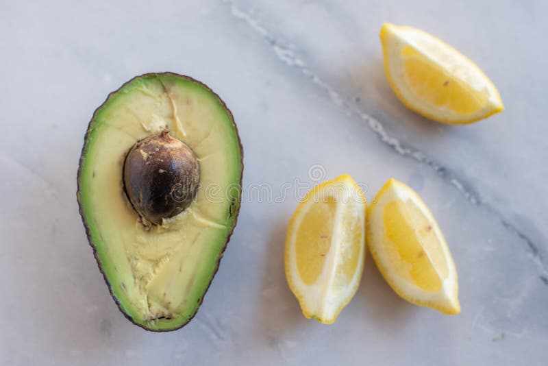 Avocado and Avocado Pieces on a Table Stock Photo - Image of salad ...