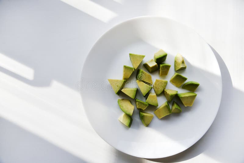 Avocado Cut into Small Slices. Avocado Salad Stock Image - Image of ...
