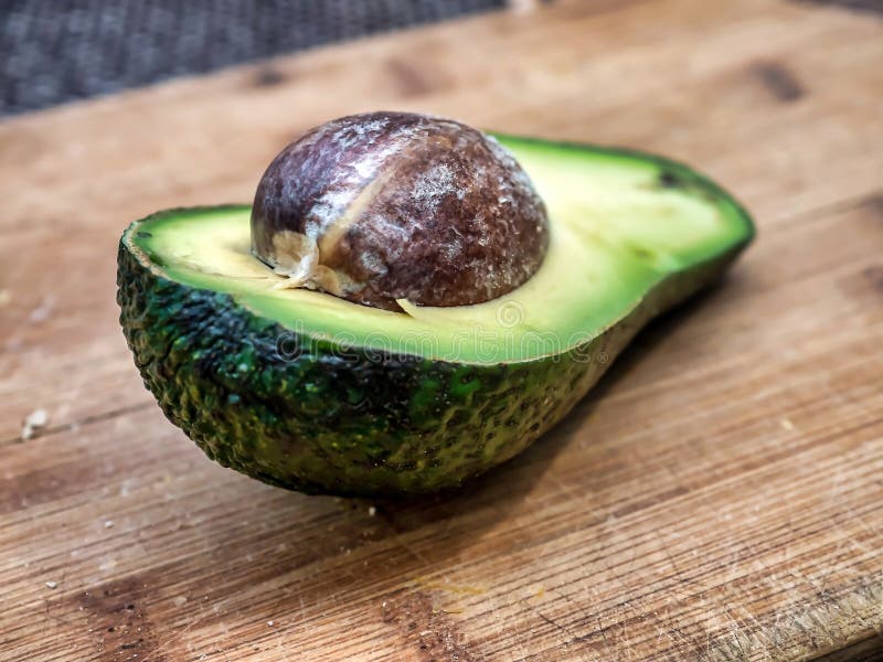 Avocado Fruit Cut in Half, the Core is Visible Stock Image - Image of ...