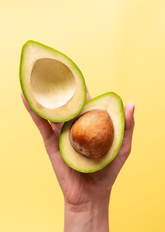 Avocado Fruit on a Yellow Background Stock Photo - Image of organic ...