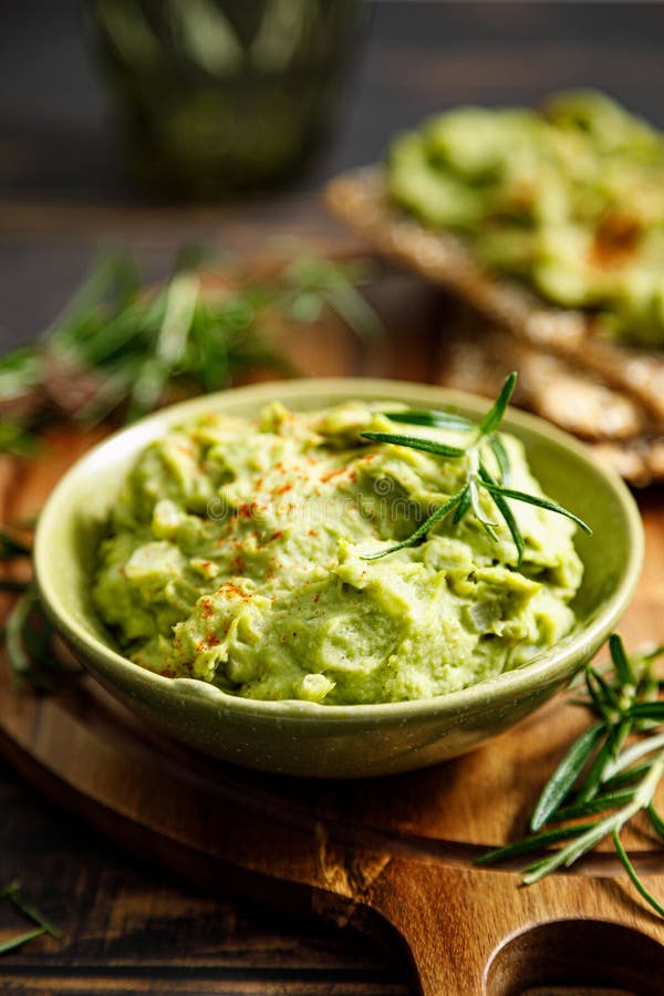 Avocado Guacamole in a Bowl Stock Image - Image of green, closeup ...