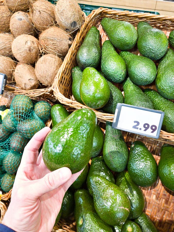 Avocado in Hand of Buyer in Shop Stock Image - Image of produce ...