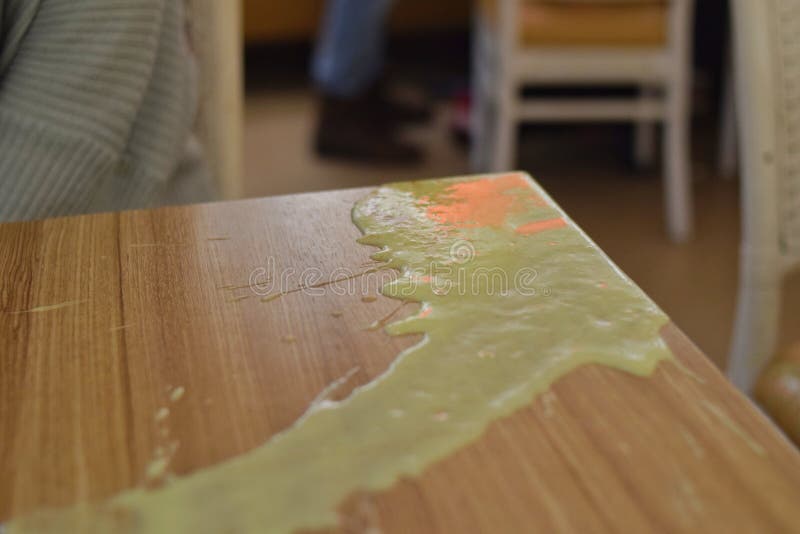 Avocado Juice Spilled on a Table Beading Up Stock Image - Image of ...