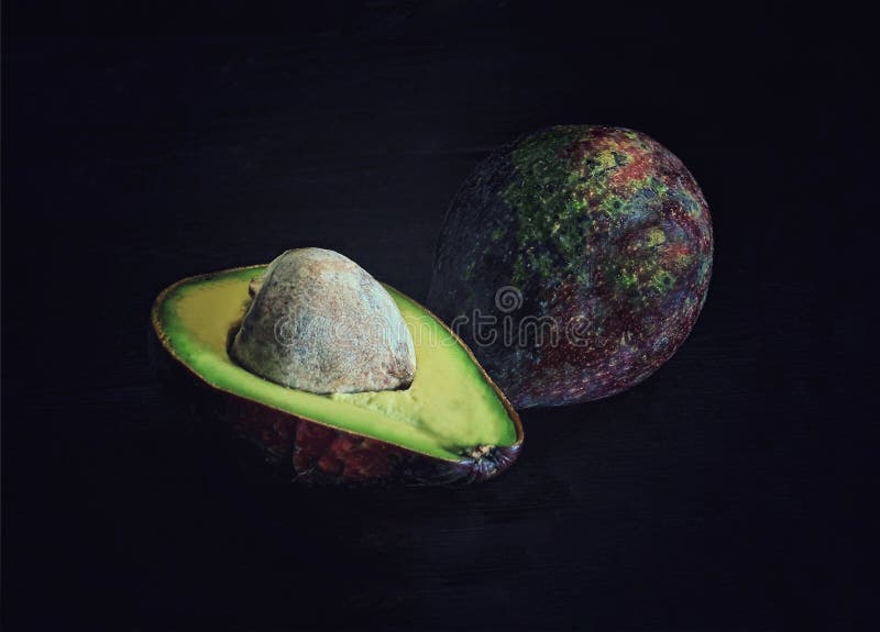 An Avocado with the Pit Inside Has Some Sort of Leaf Stock Photo ...