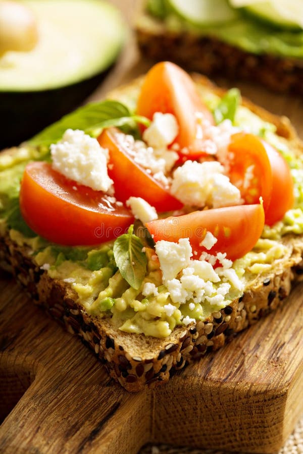 Avocado Toast with Tomatoes and Feta Stock Photo - Image of homemade ...