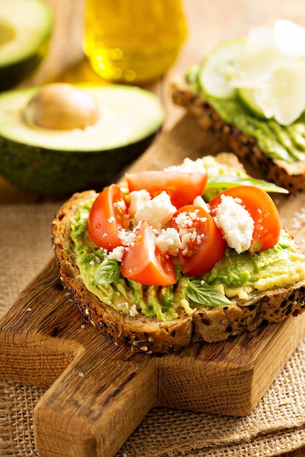 Avocado Toast with Tomatoes and Feta Stock Photo - Image of appetizer ...